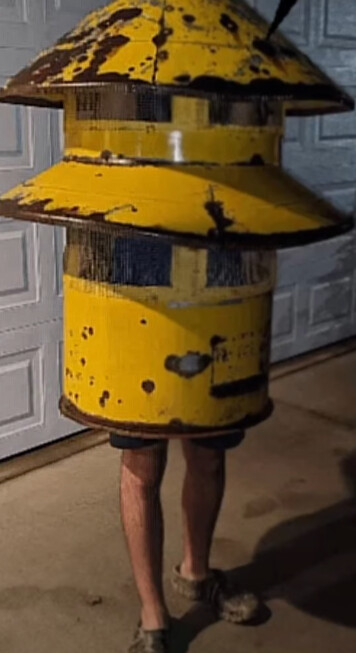 Man wearing the cover of a Federal sign and signal model 7 - Emergency ...